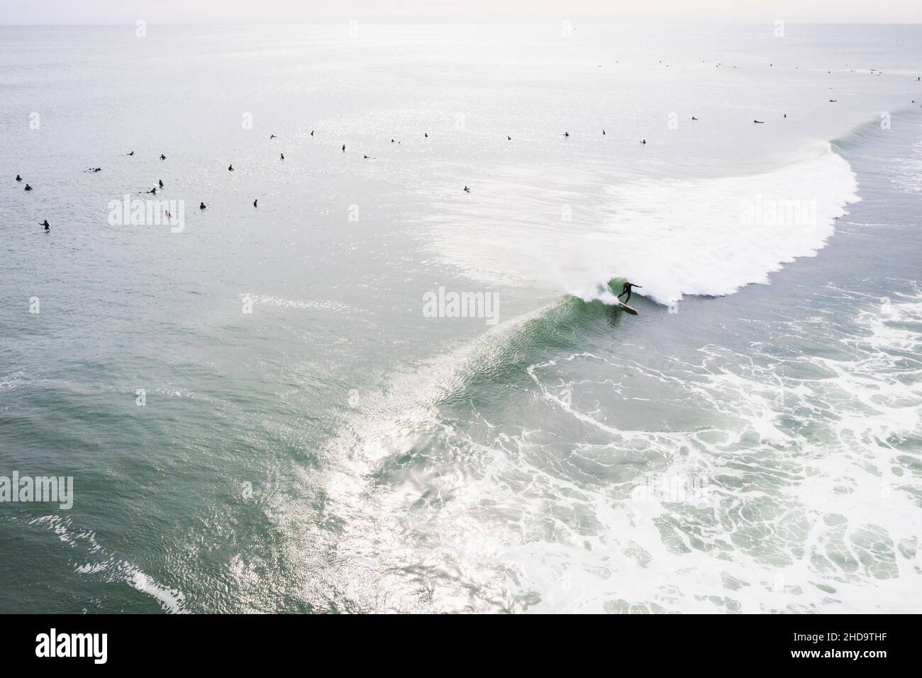 Aerial of Surfers on long hurricane waves in Rhode Island Stock Photo ...