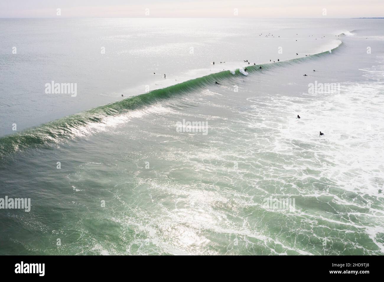 Aerial of Surfers on long hurricane waves in Rhode Island Stock Photo ...