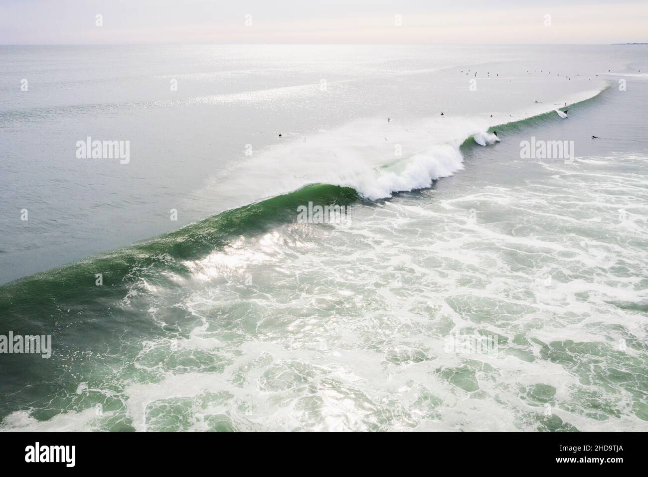 Aerial of Surfers on long hurricane waves in Rhode Island Stock Photo ...