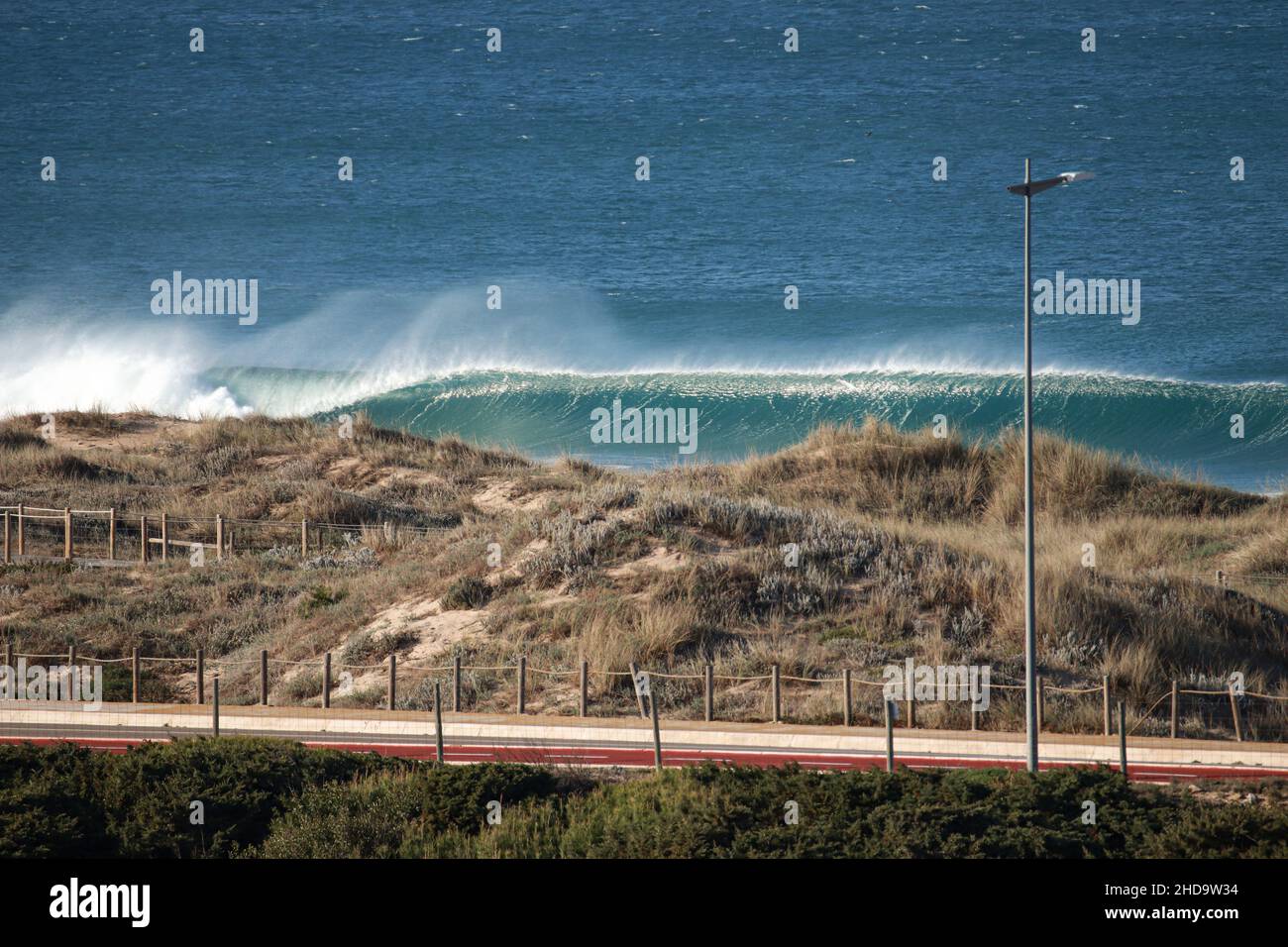Perfect wave breaking in a beach. Surf spot Stock Photo - Alamy