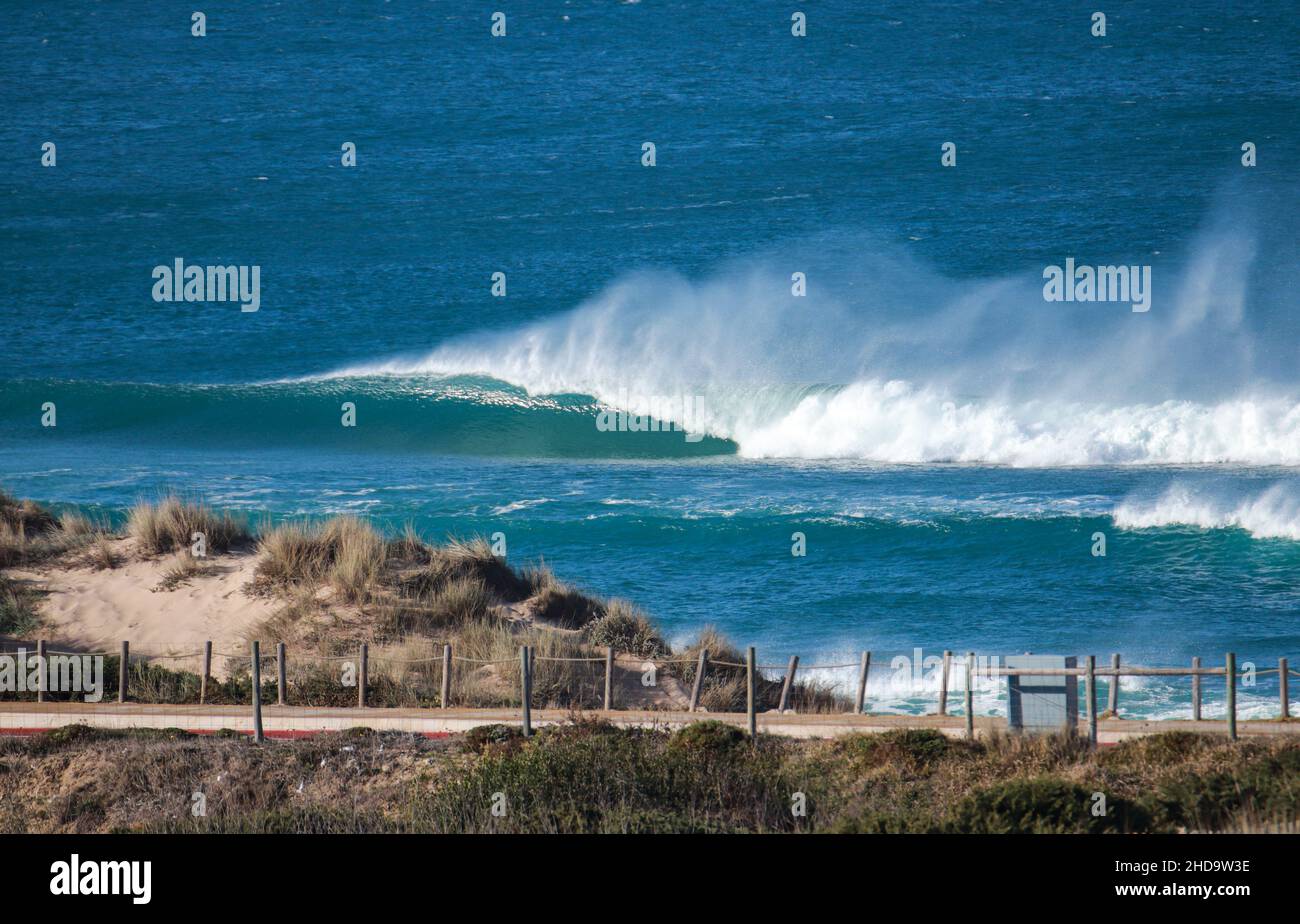 Perfect wave breaking in a beach. Surf spot Stock Photo - Alamy