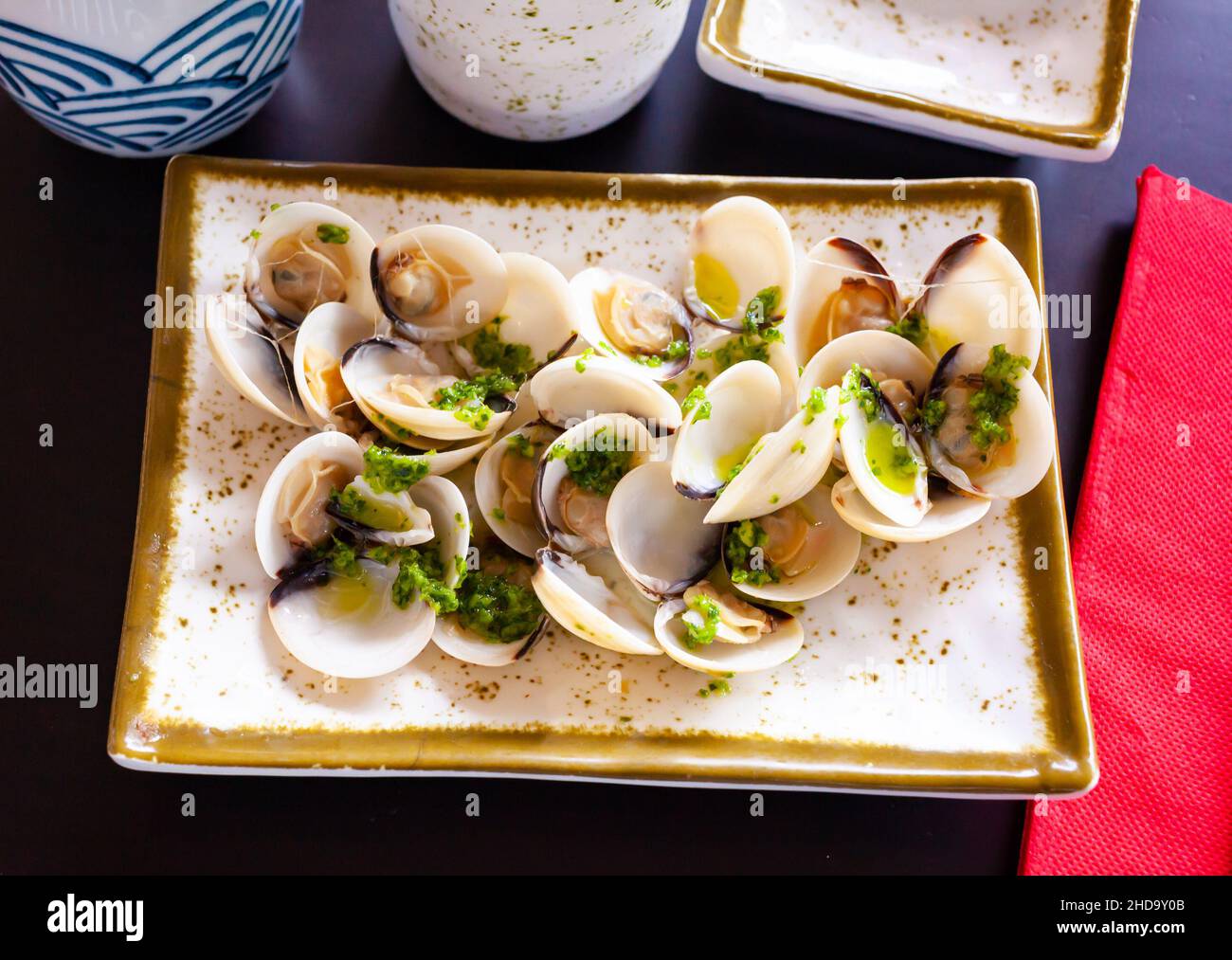 Japanese sake steamed clams with garlic and green onions Stock Photo ...