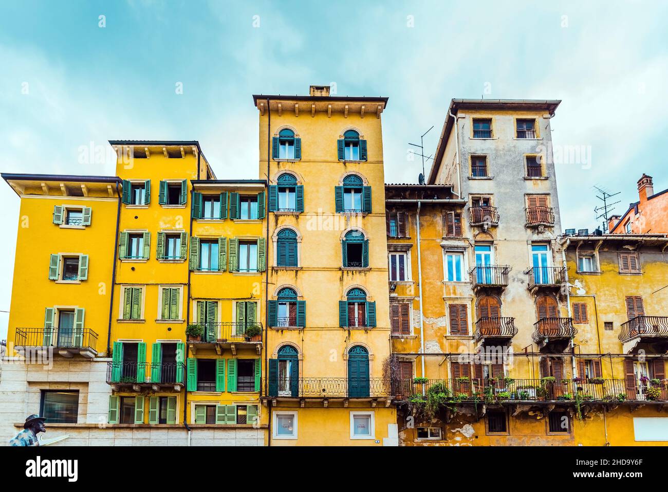Faded and old facades of houses in the old town of the city of Verona ...