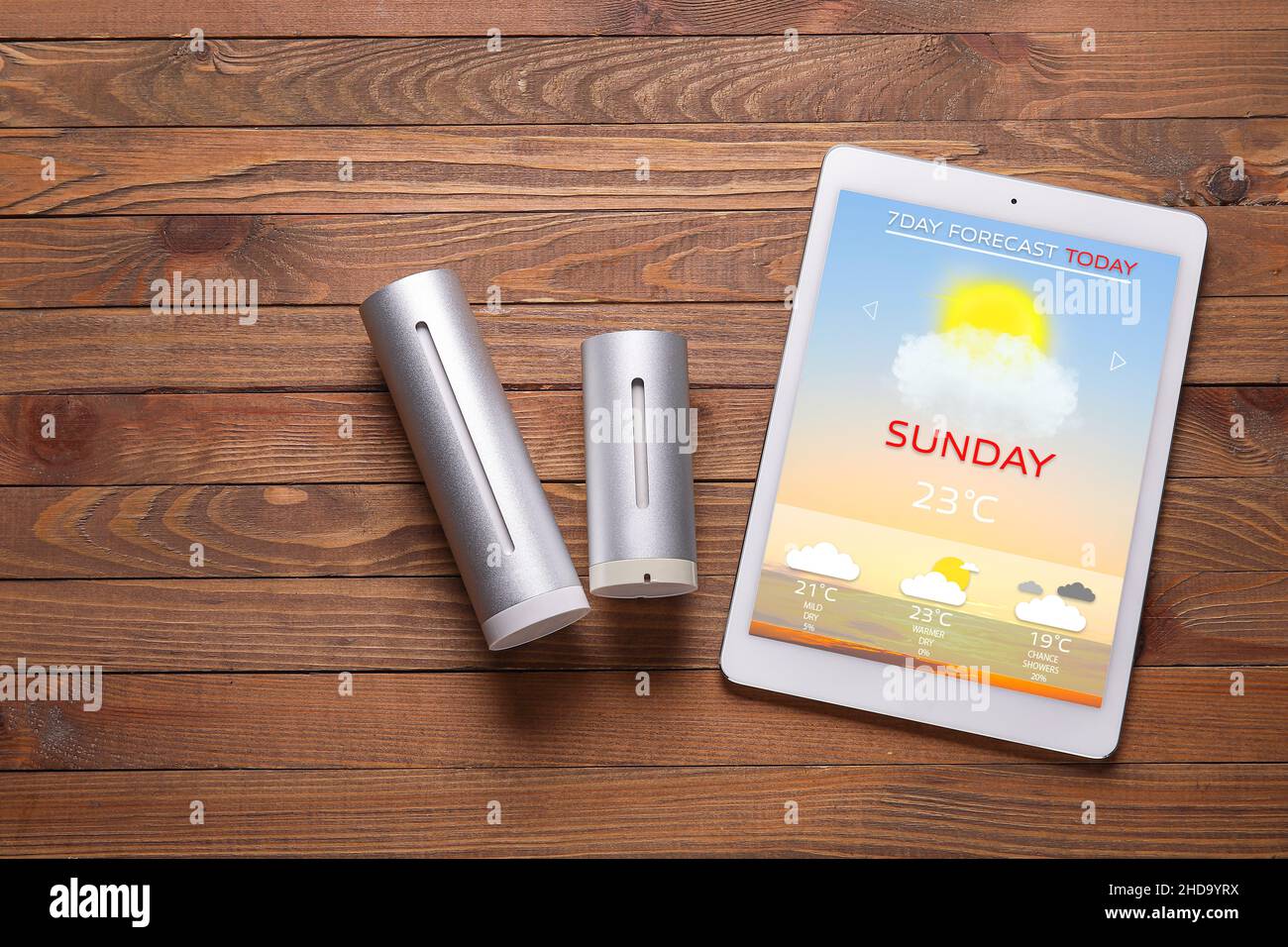 Weather forecast equipment and tablet computer on wooden background ...