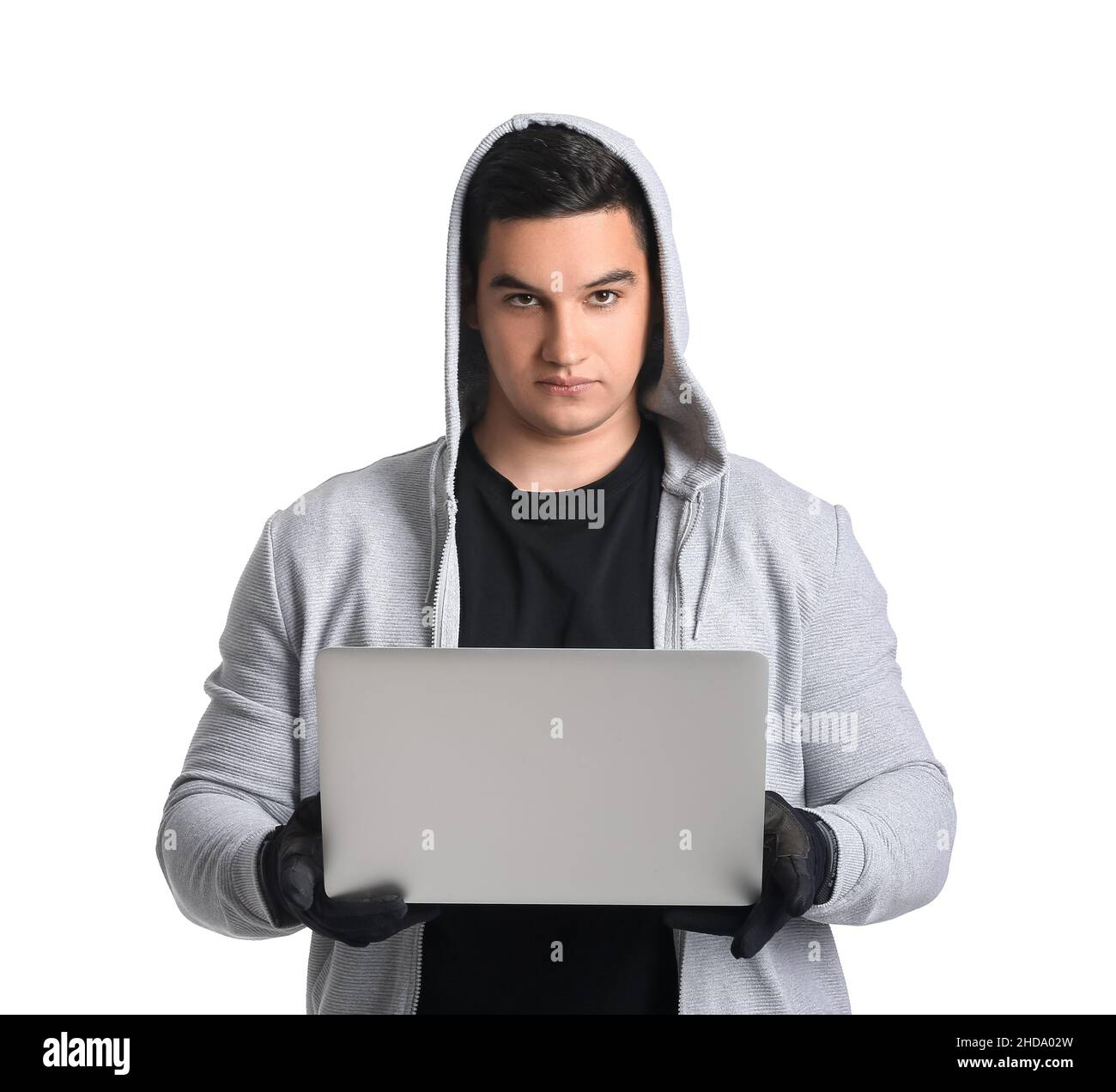 Hacker with laptop on white background Stock Photo - Alamy