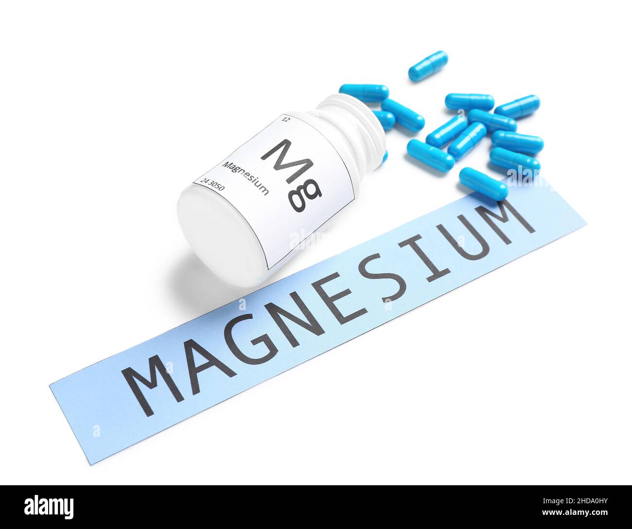 Bottle with capsules and word MAGNESIUM on white background Stock Photo ...