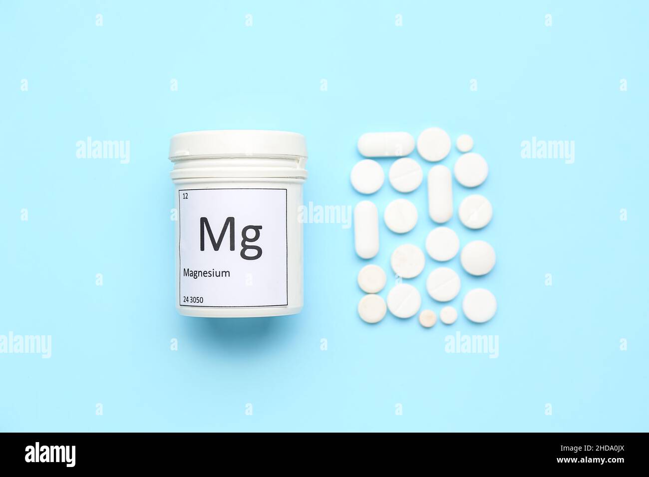 Composition with different magnesium pills on color background Stock ...