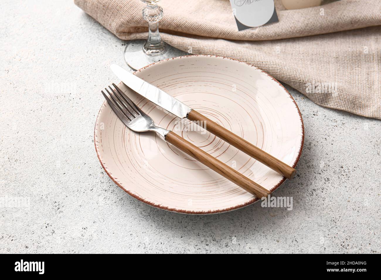 Beautiful table setting for wedding on light background Stock Photo - Alamy