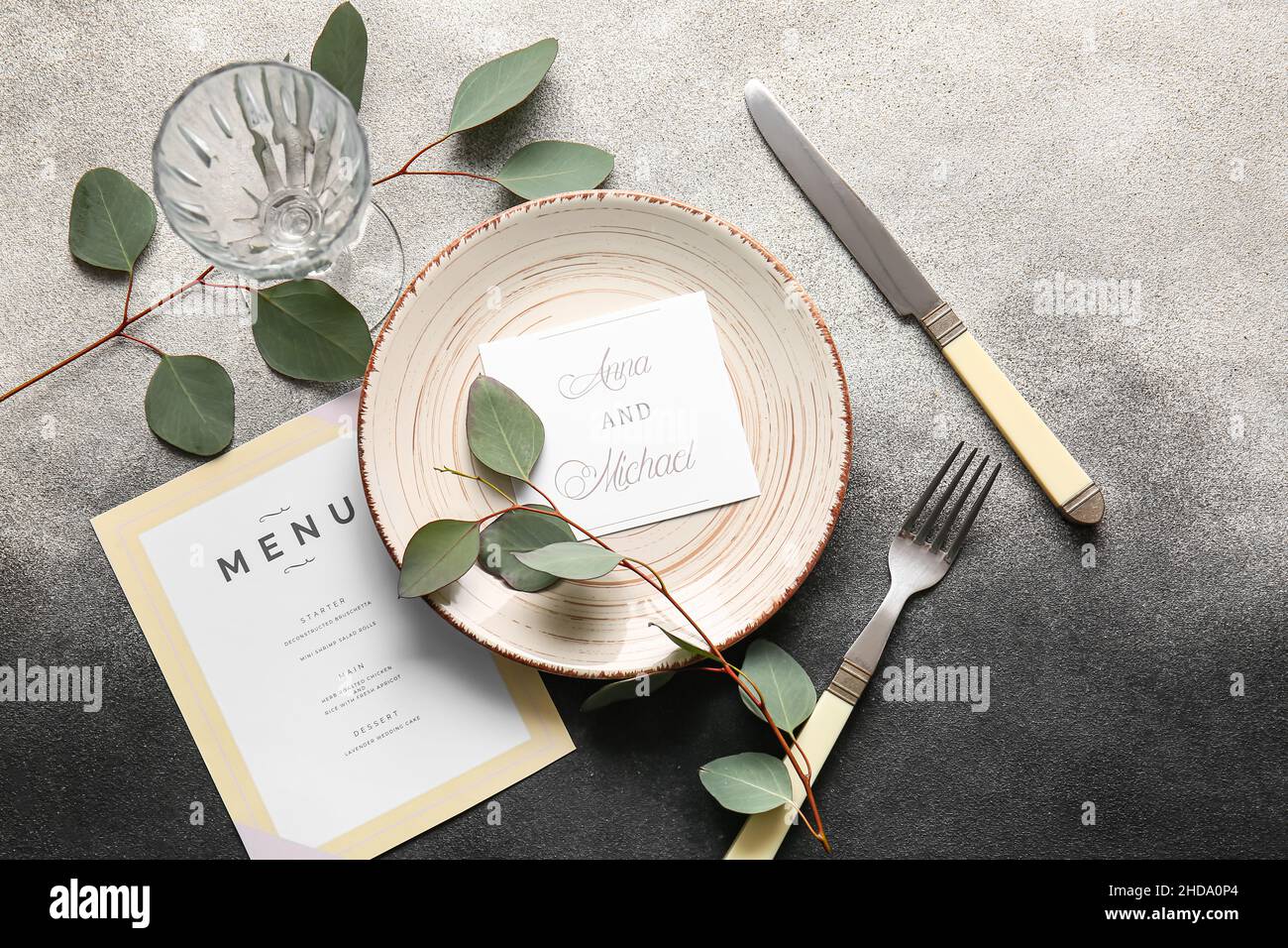 Beautiful table setting with wedding invitation and menu on grunge ...