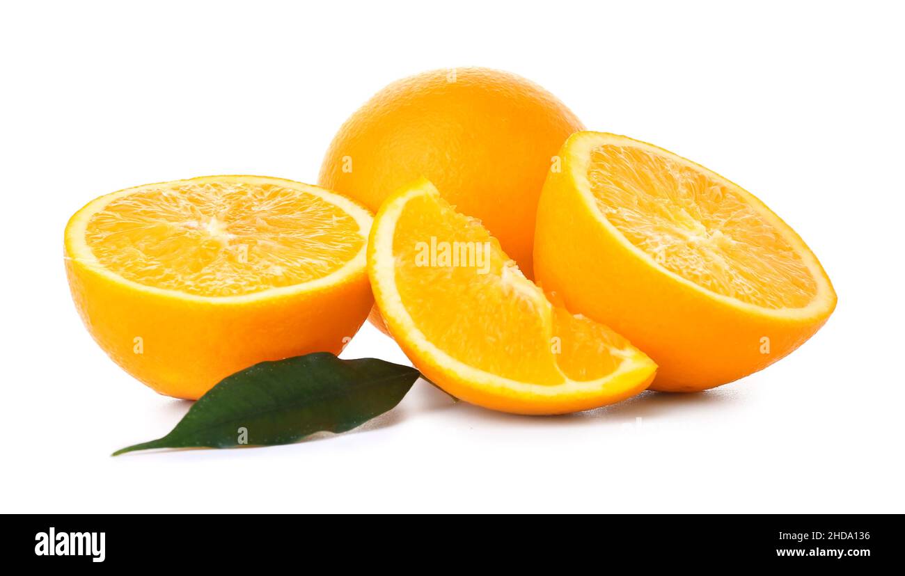 Ripe fresh cut oranges on white background Stock Photo - Alamy