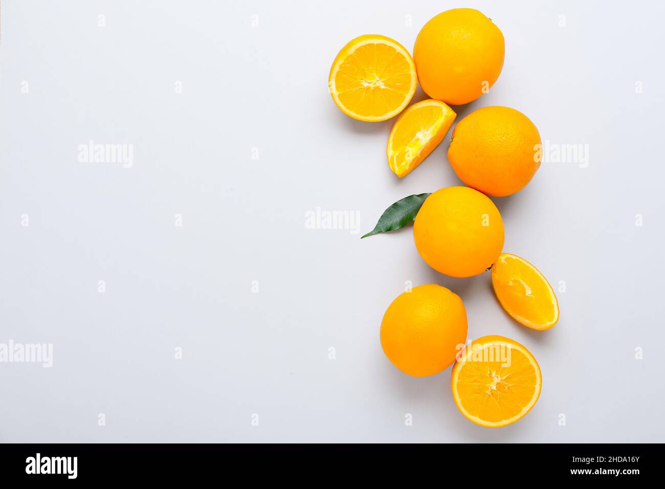 Ripe fresh oranges on white background Stock Photo - Alamy