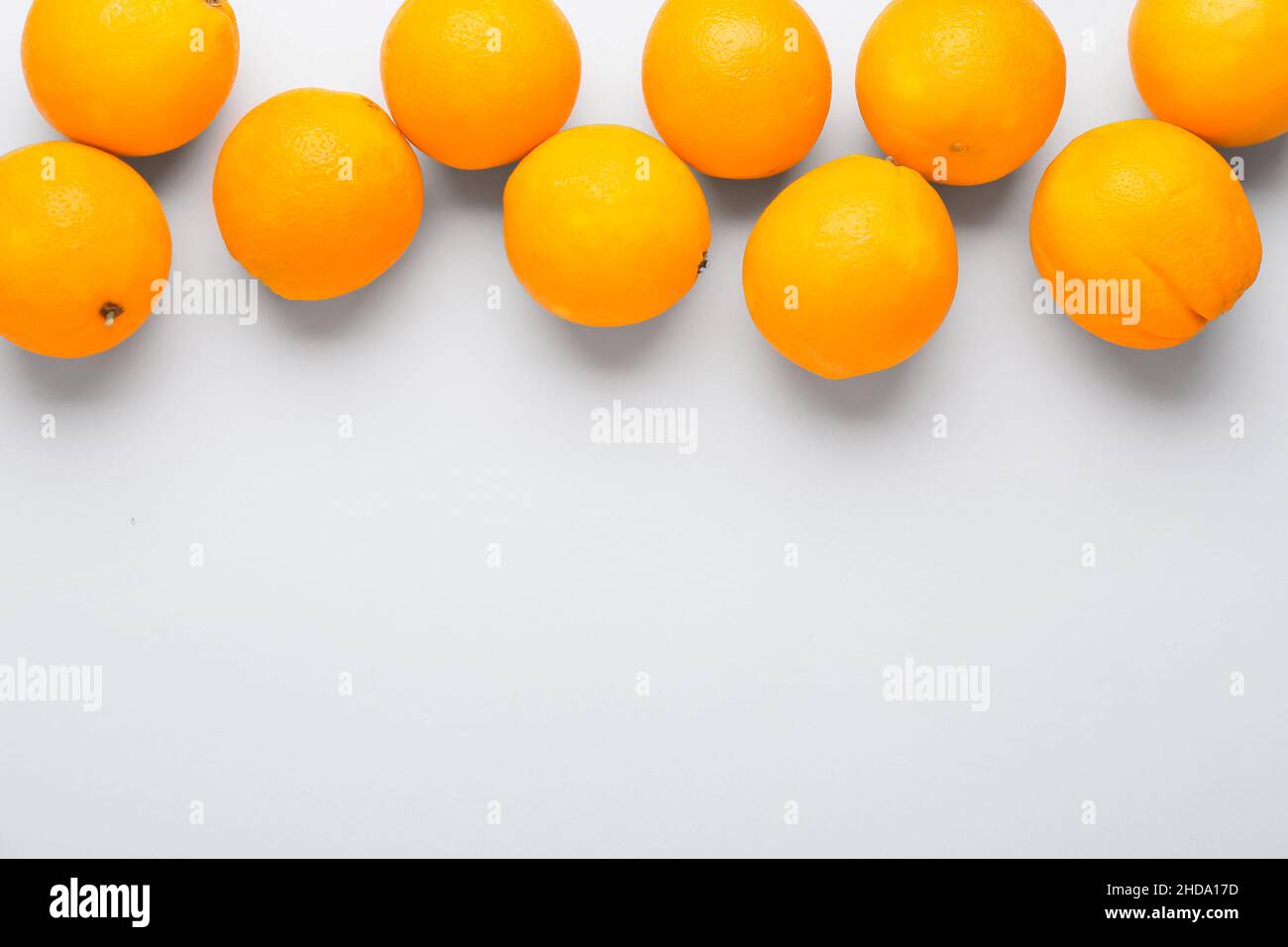 Ripe fresh oranges on white background Stock Photo - Alamy