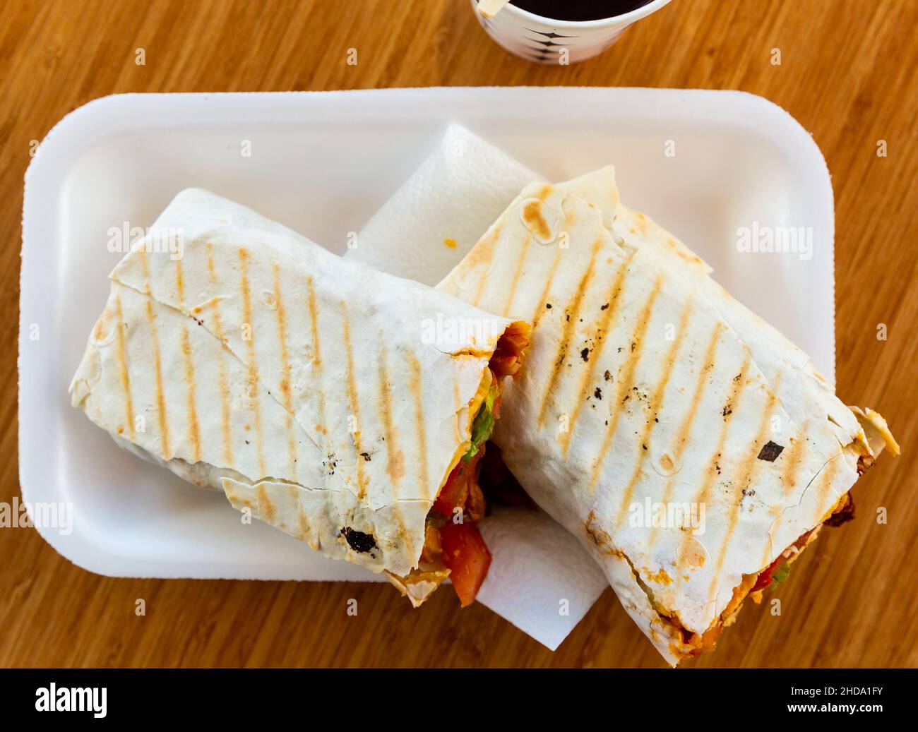 Turkish fast food, wrapped dish durum kebab Stock Photo - Alamy