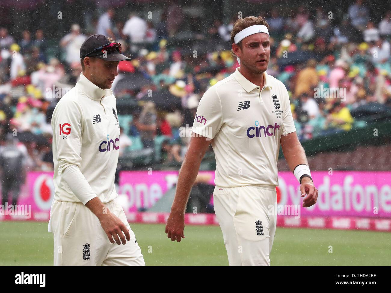 England's Joe Root ( Left ) and Stuart Broad walk off as rain stops ...