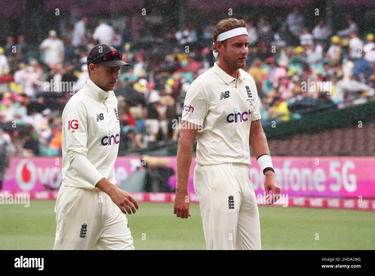 England's Joe Root ( Left ) and Stuart Broad walk off as rain stops ...