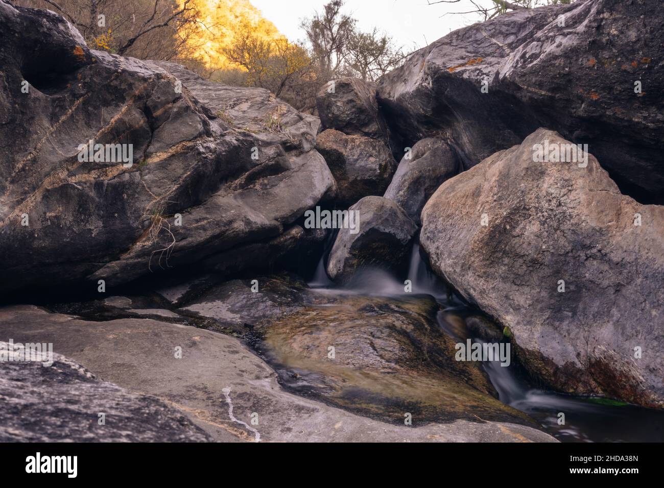 Mountainous river with giant rocks around in Argentina Stock Photo - Alamy