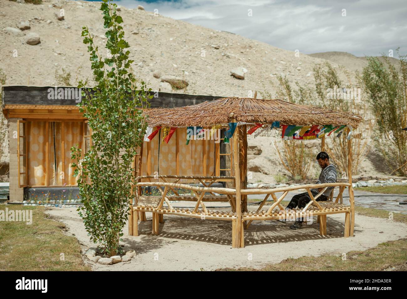 Person sitting at an outdoor cafe hut seat in Ladakh, India Stock Photo ...