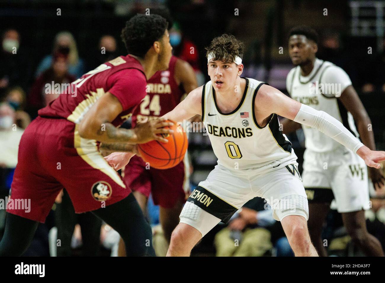 Winston-Salem, NC, USA. 4th Jan, 2022. Wake Forest Demon Deacons forward Jake LaRavia (0) guards ...