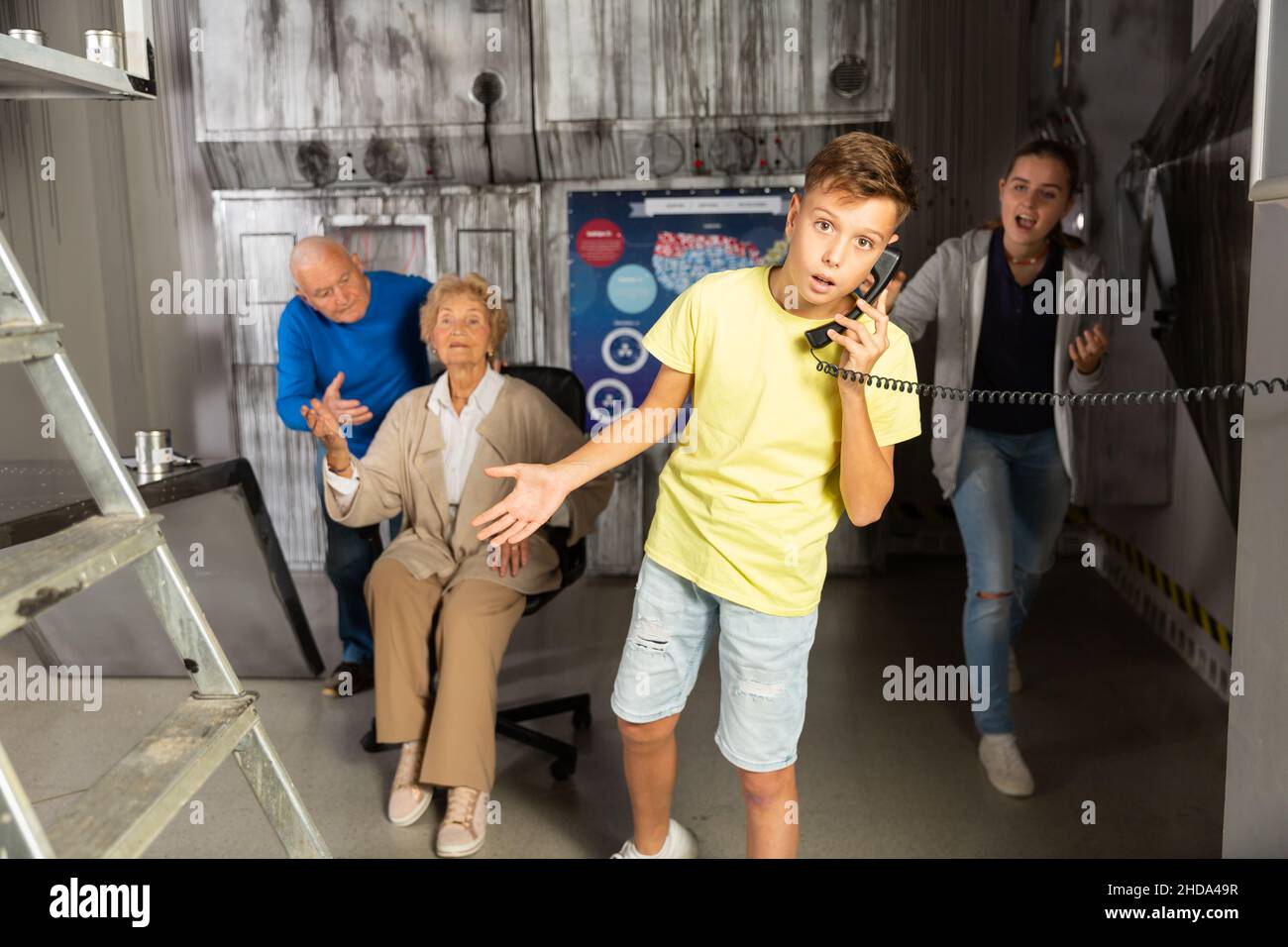 Scared boy shouts into telephone receiver Stock Photo - Alamy