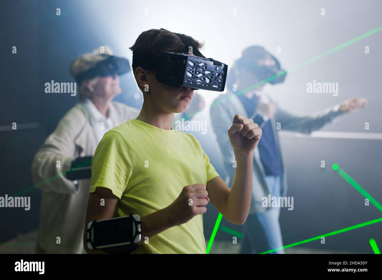 Family are wearing virtual reality goggles in quest room Stock Photo ...