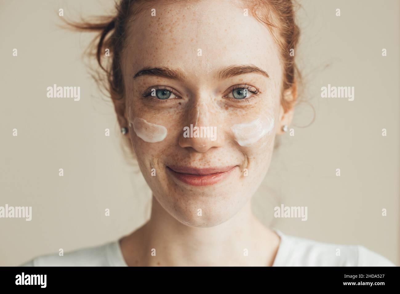 Closeup portrait of woman face with cream on cheek. Caucasian woman ...
