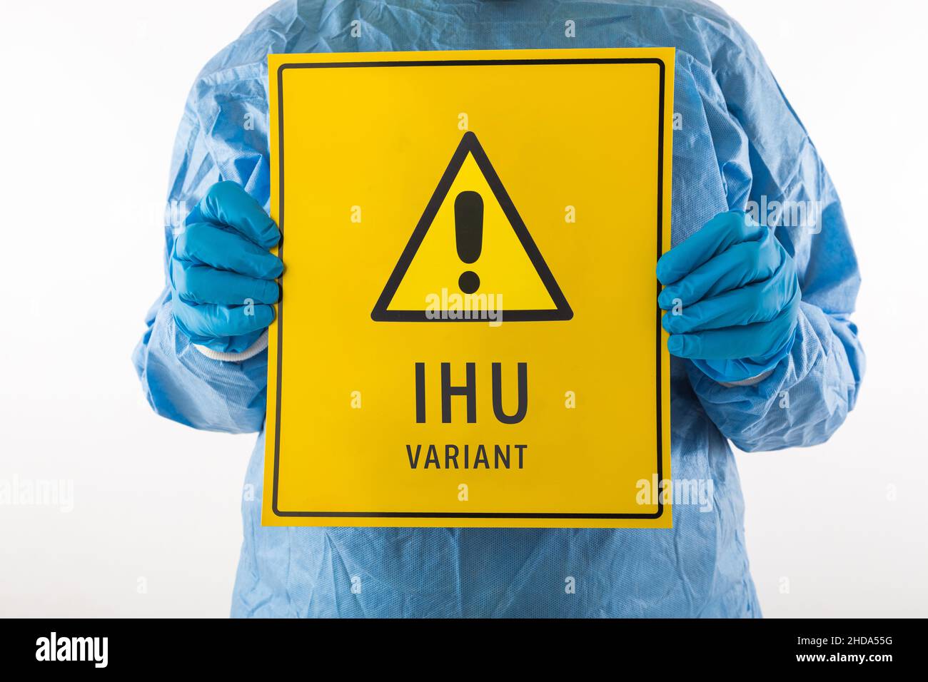 Detail of an arm of a medical nurse wearing a PPE and latex gloves with ...