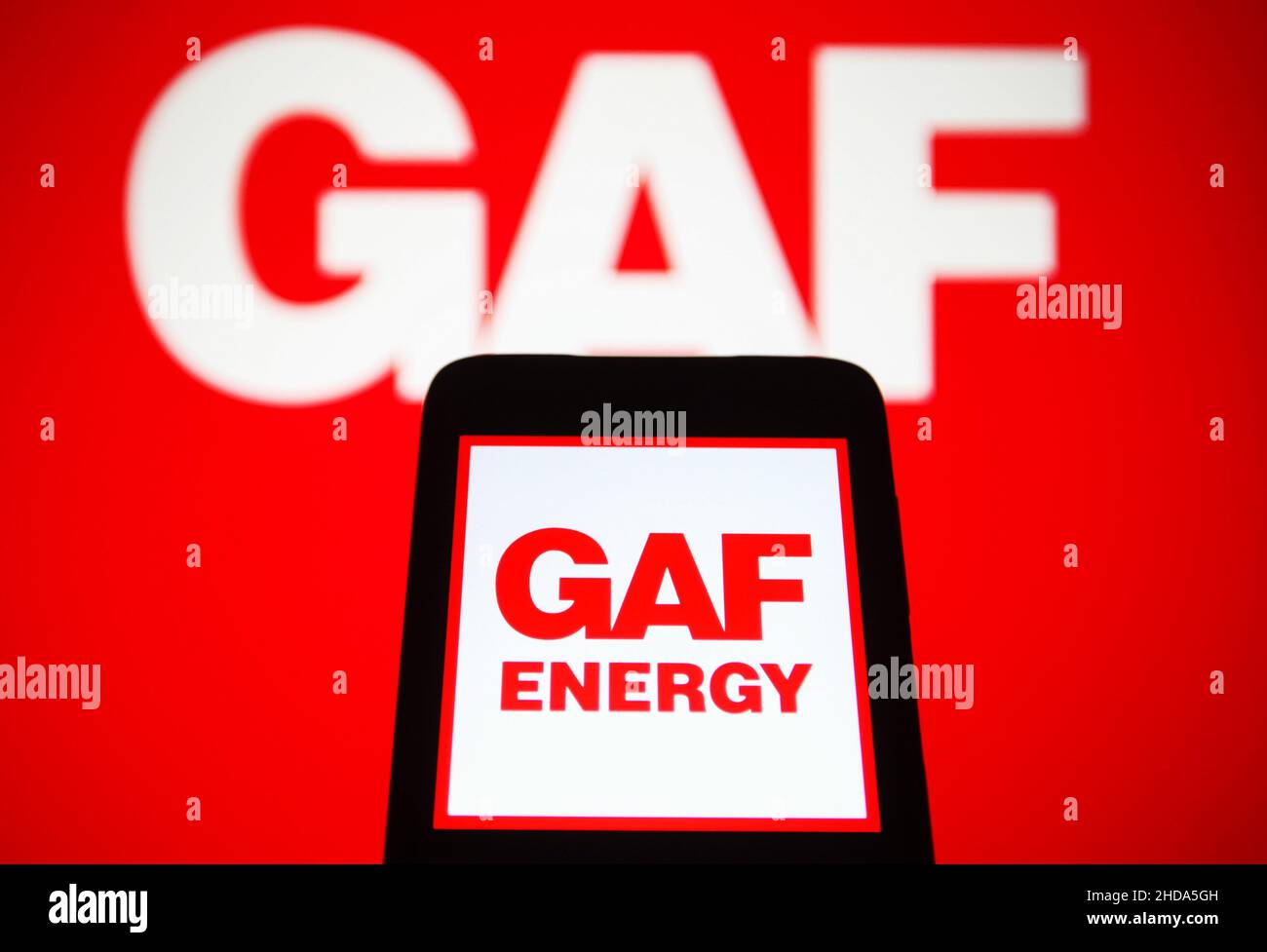 In this photo illustration, a GAF Energy logo is seen on a smartphone ...