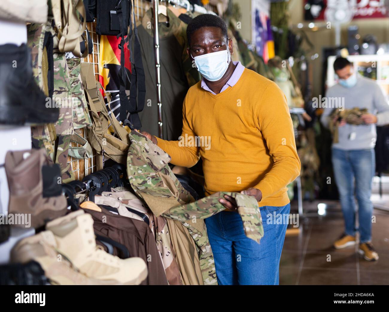 African-american man in mask in military goods store Stock Photo - Alamy