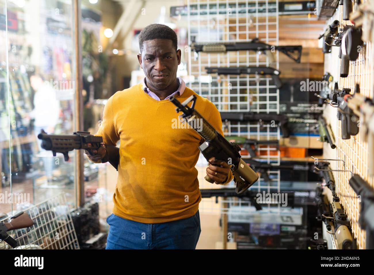 African-american man in airsoft shop Stock Photo - Alamy