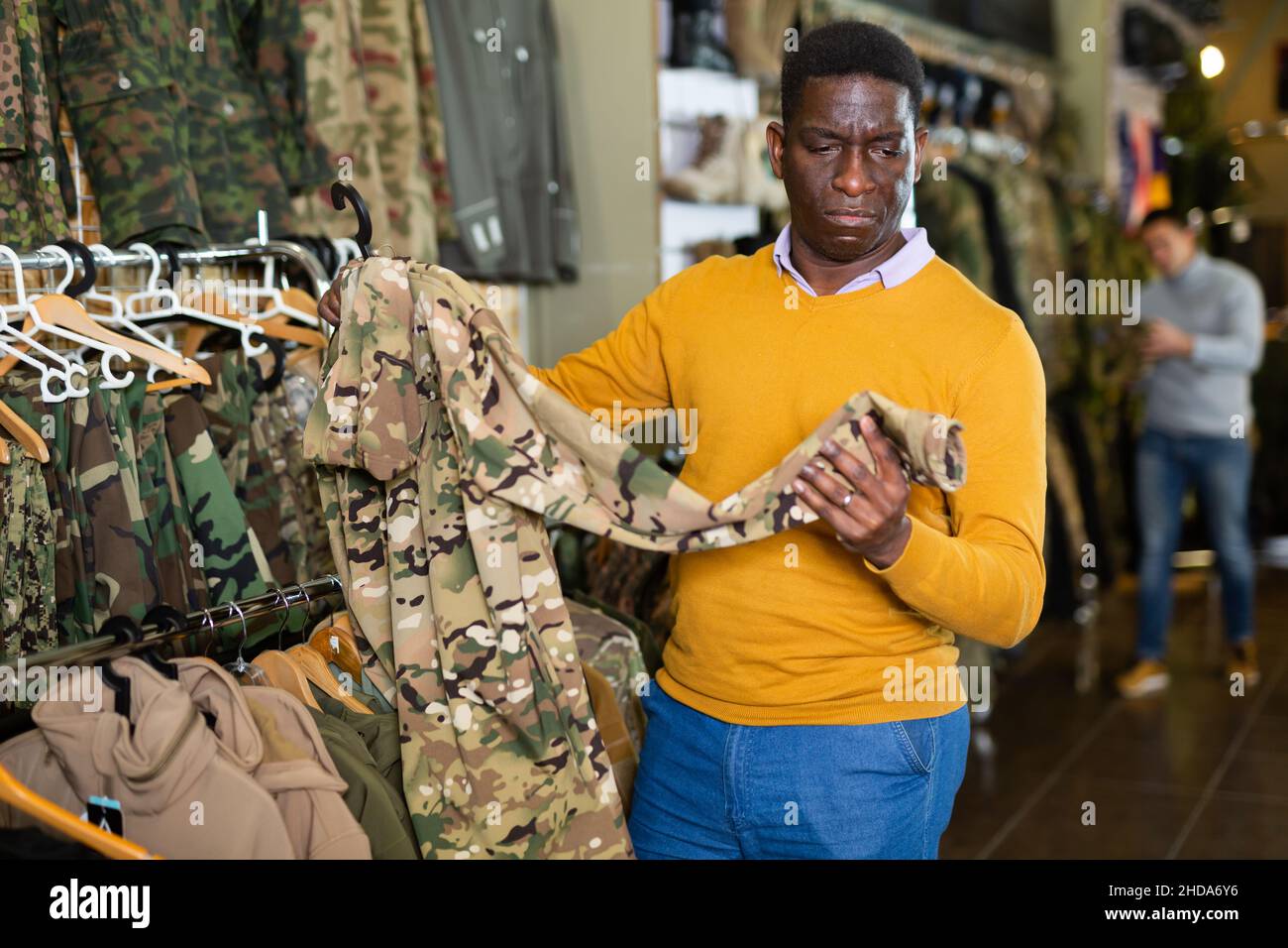 African-american man in military goods store Stock Photo - Alamy