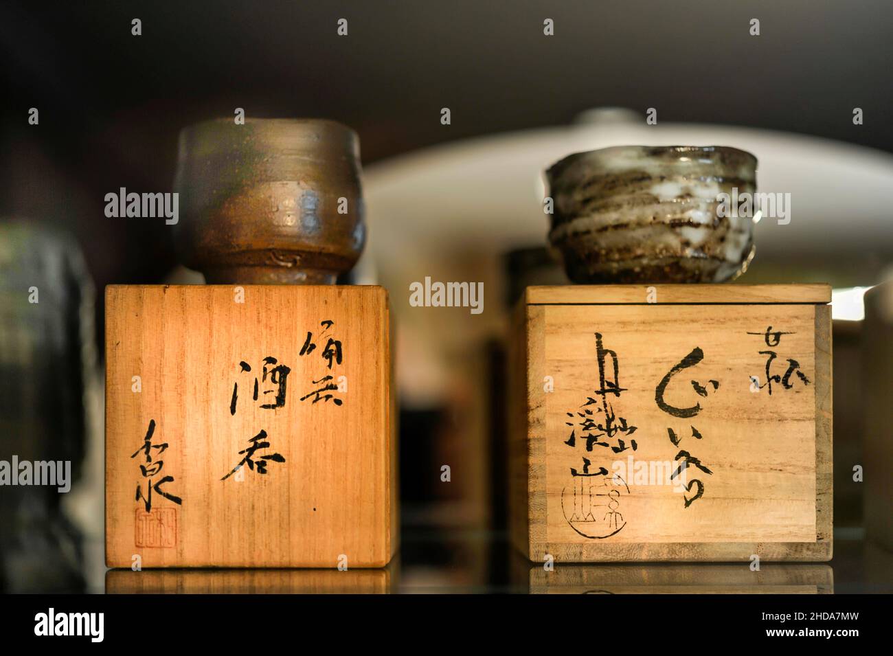 Japanese sake cups with wooden storage boxes Stock Photo - Alamy