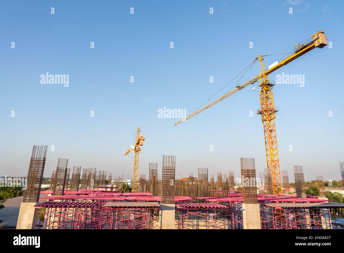 Crane on the steel and concrete structure of the building at the ...