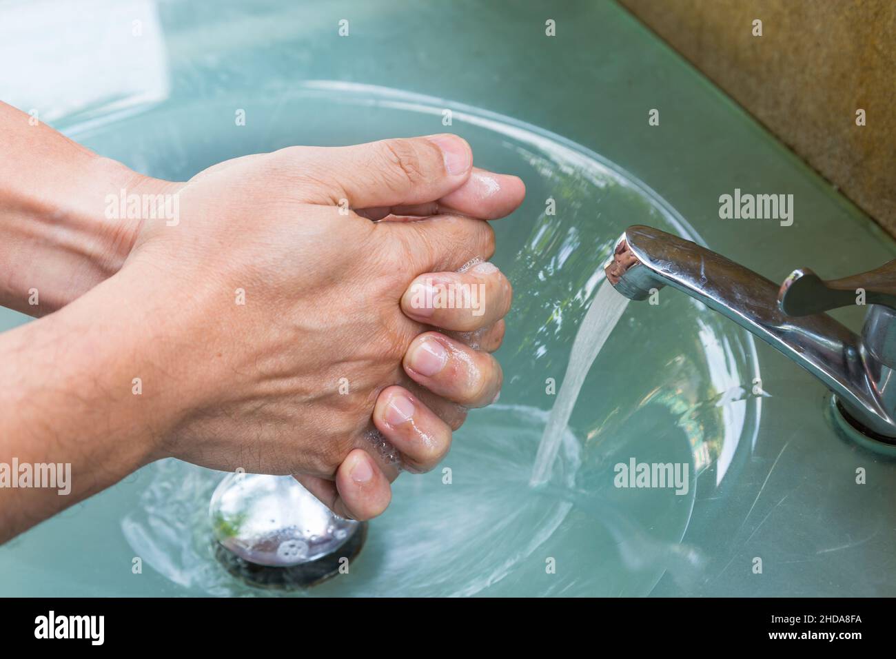 man washing hands before eating Stock Photo - Alamy