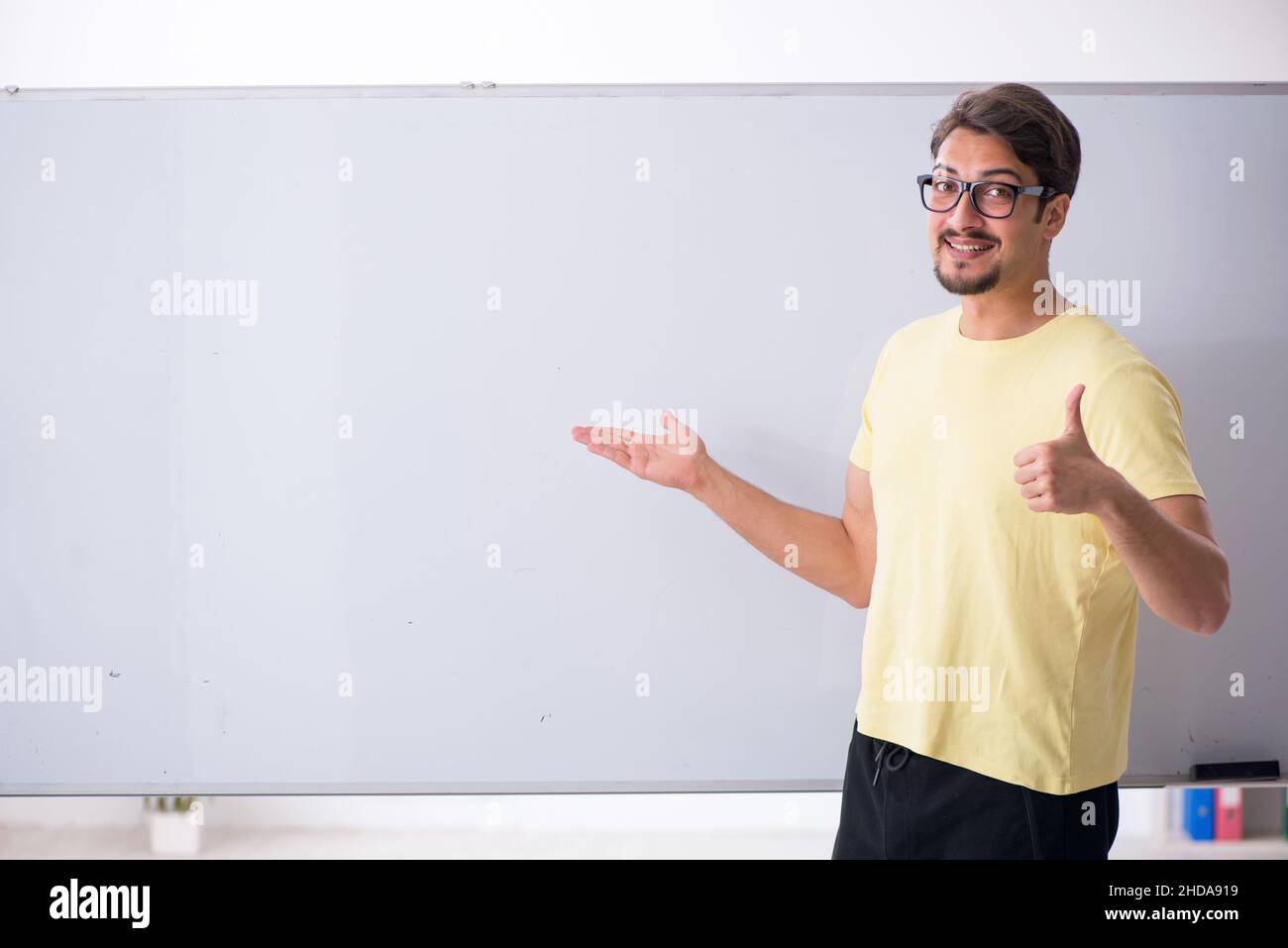Young student in front of whiteboard Stock Photo - Alamy