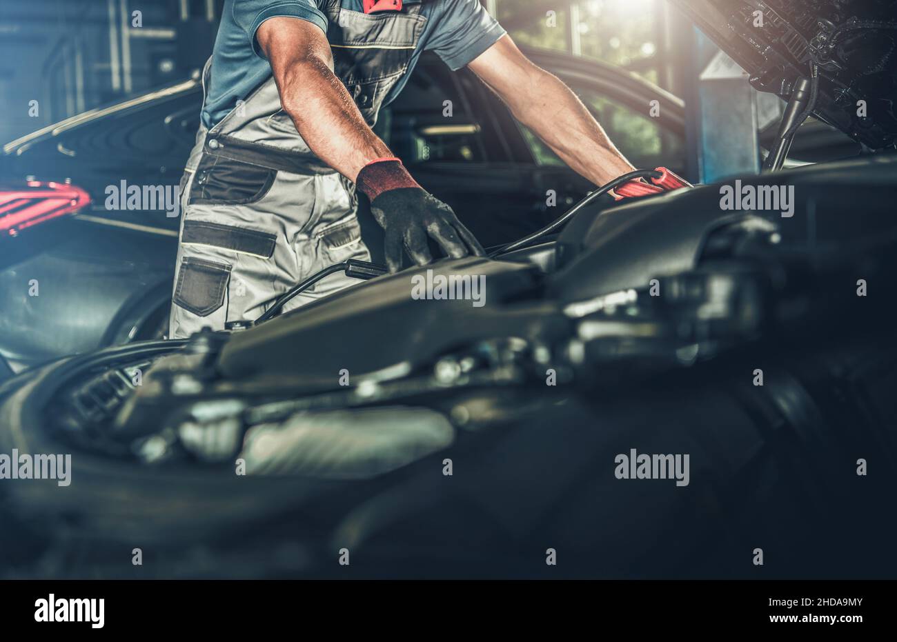 Automotive Industry Concept. Car Mechanic Looking Under Vehicle Hood ...