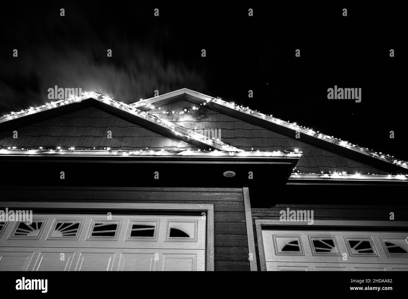 Sagging Christmas lights outdoors on a house that have come loose from ...