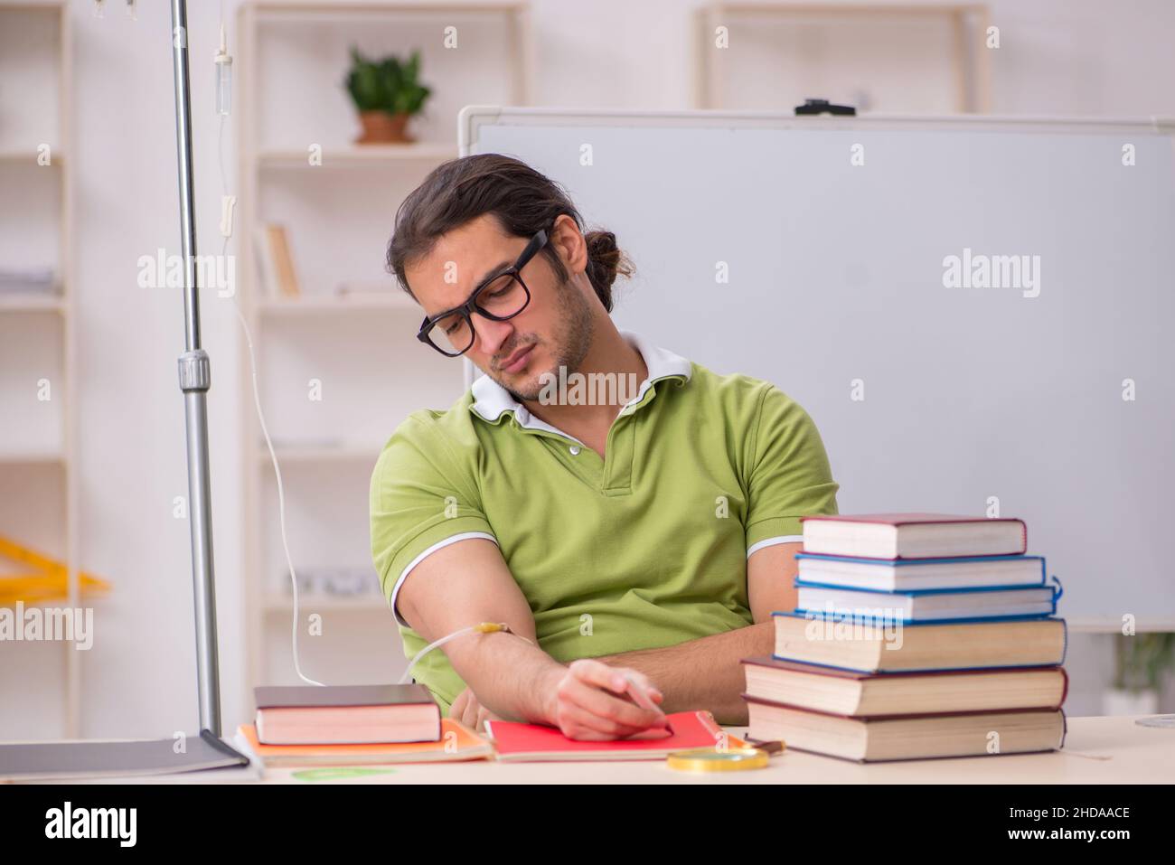 Young sick teacher student in blood transfusion concept Stock Photo - Alamy