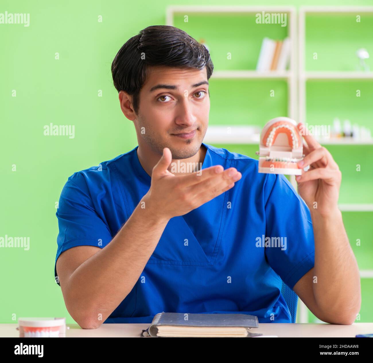 The man dentist working on new teeth implant Stock Photo - Alamy