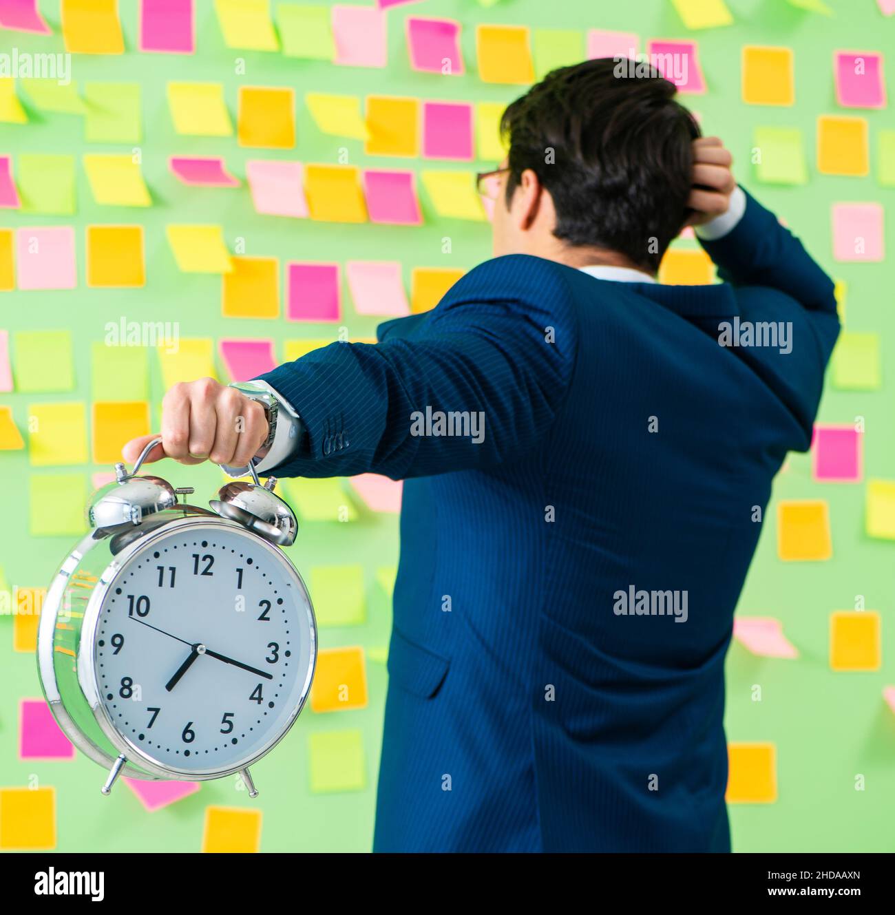 The businessman with many business priorities Stock Photo - Alamy