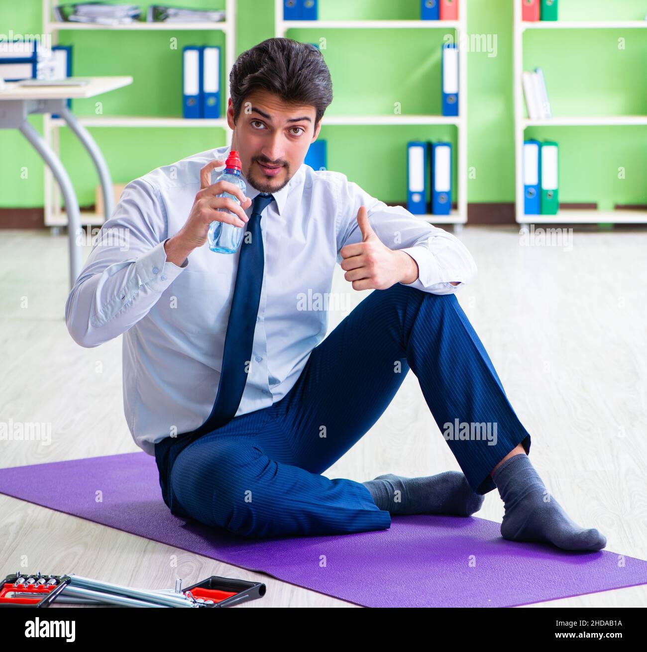 The employee doing exercises during break at work Stock Photo - Alamy