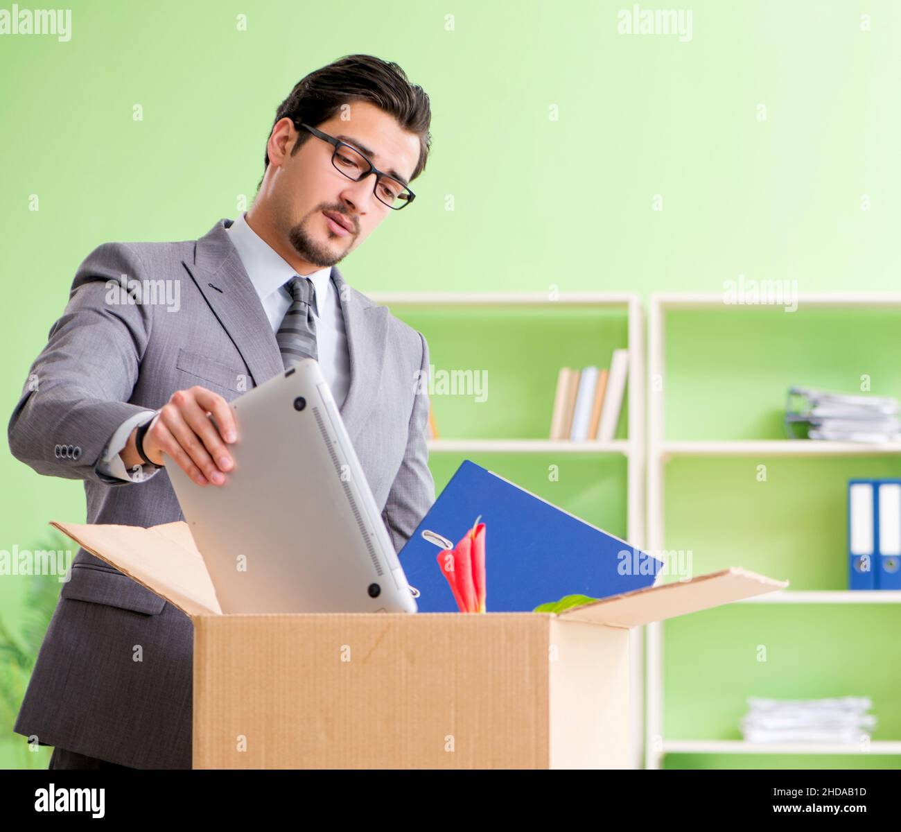 The male employee collecting his stuff after redundancy Stock Photo - Alamy