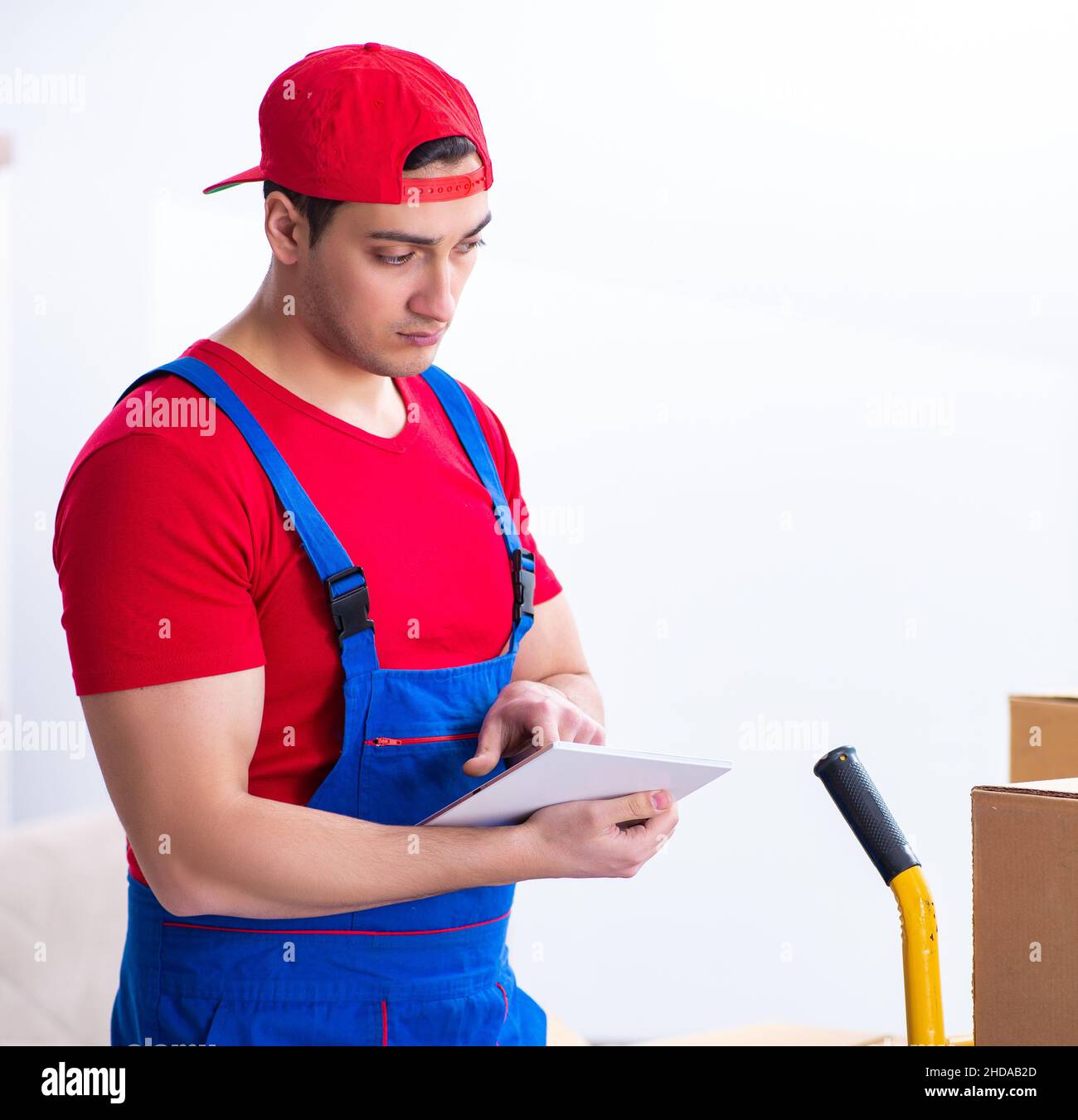 The contractor worker moving boxes during office move Stock Photo - Alamy
