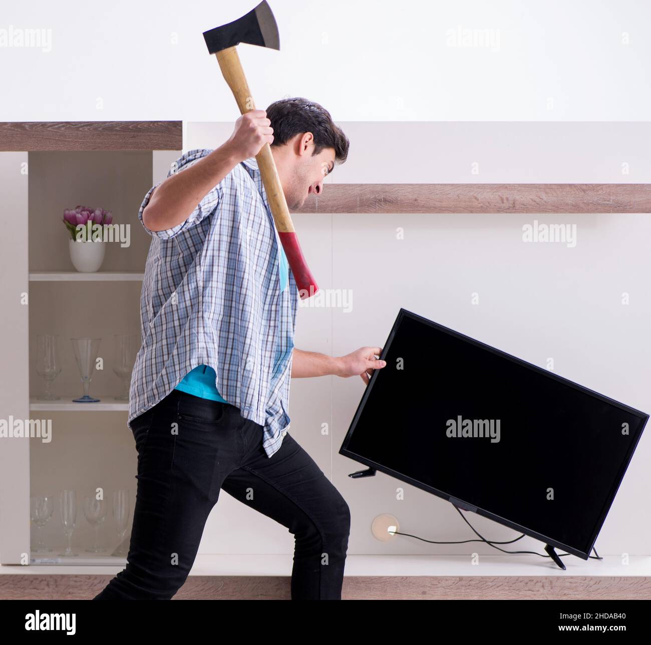 The man trying to fix broken tv Stock Photo - Alamy