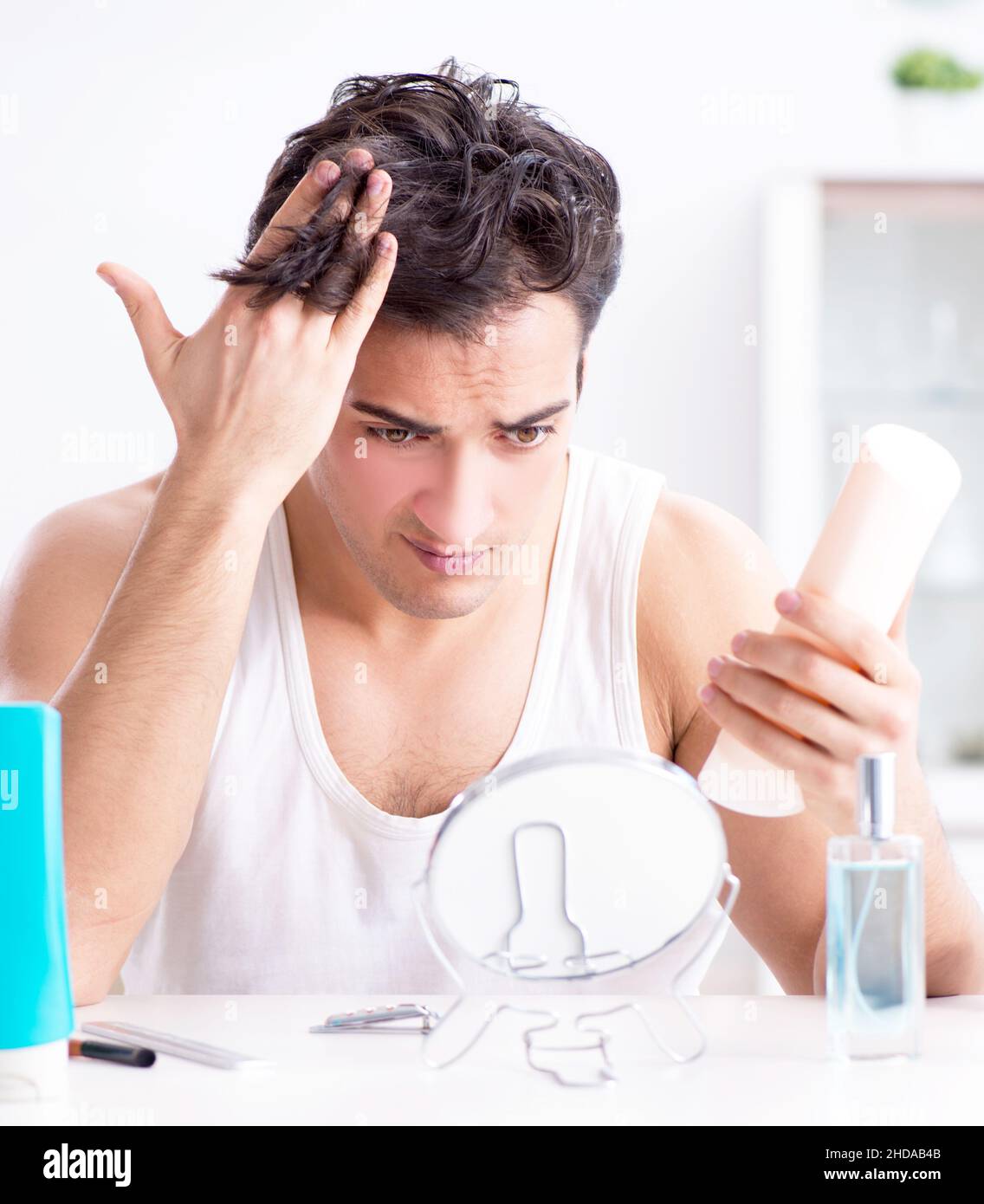 The young handsome man staring in the mirror Stock Photo - Alamy