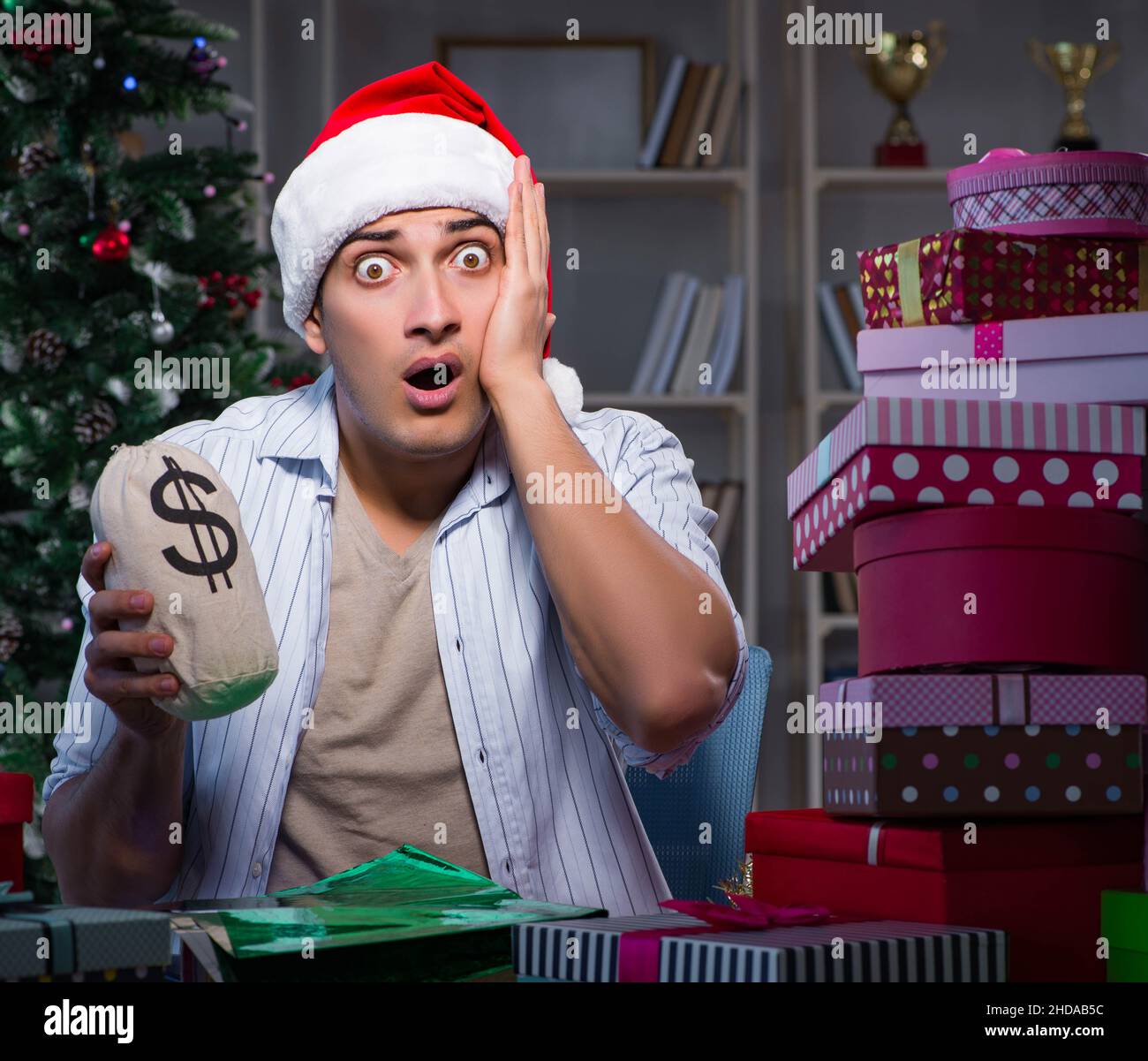 The man with many christmas gifts in boxes Stock Photo - Alamy