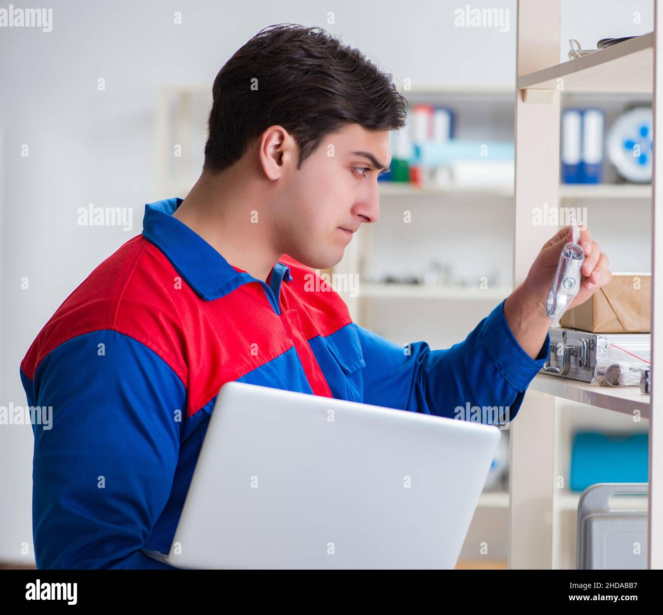 The man working in the postal warehouse Stock Photo - Alamy