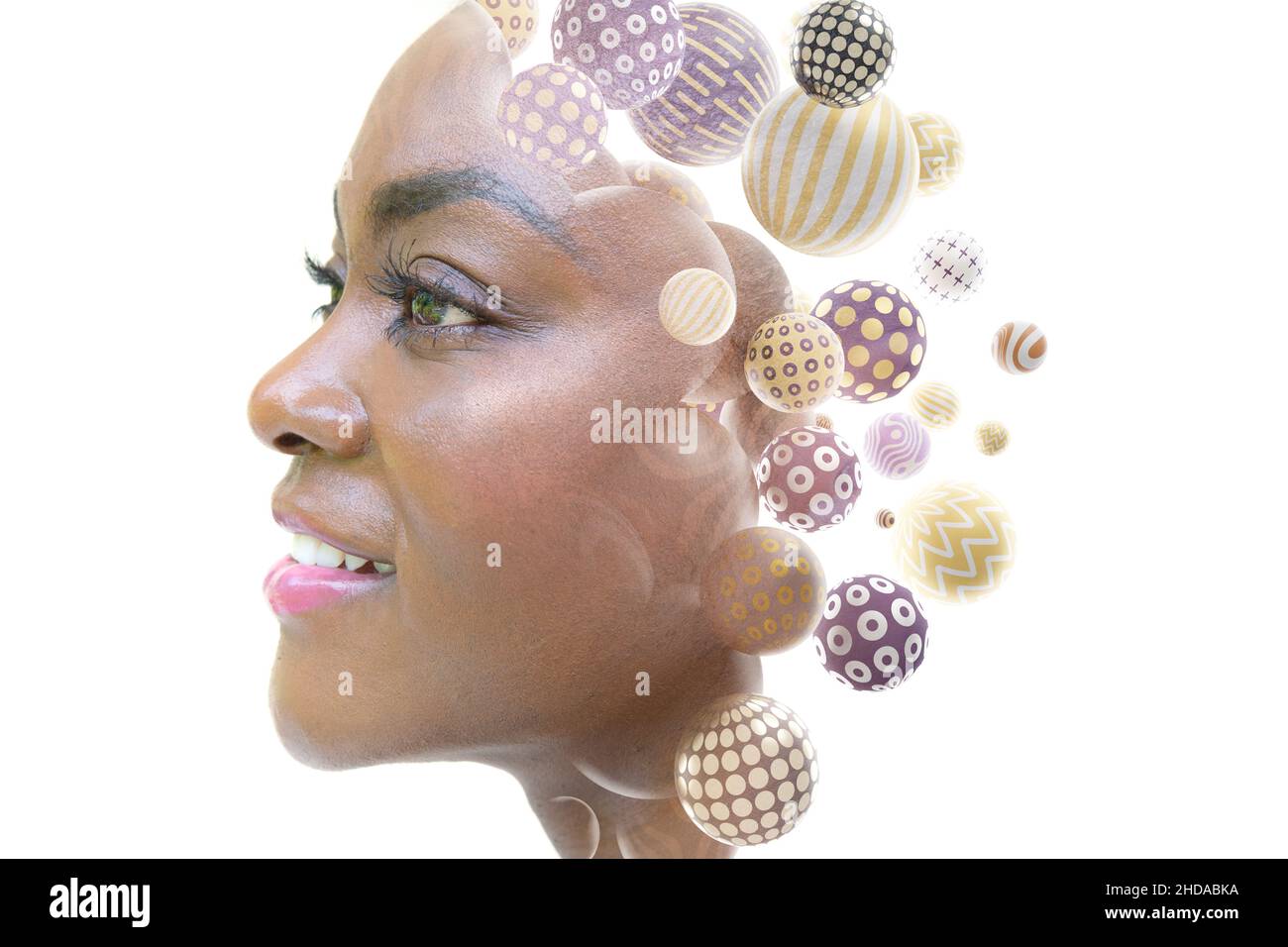 A portrait of a woman combined with 3D spheres in a double exposure ...
