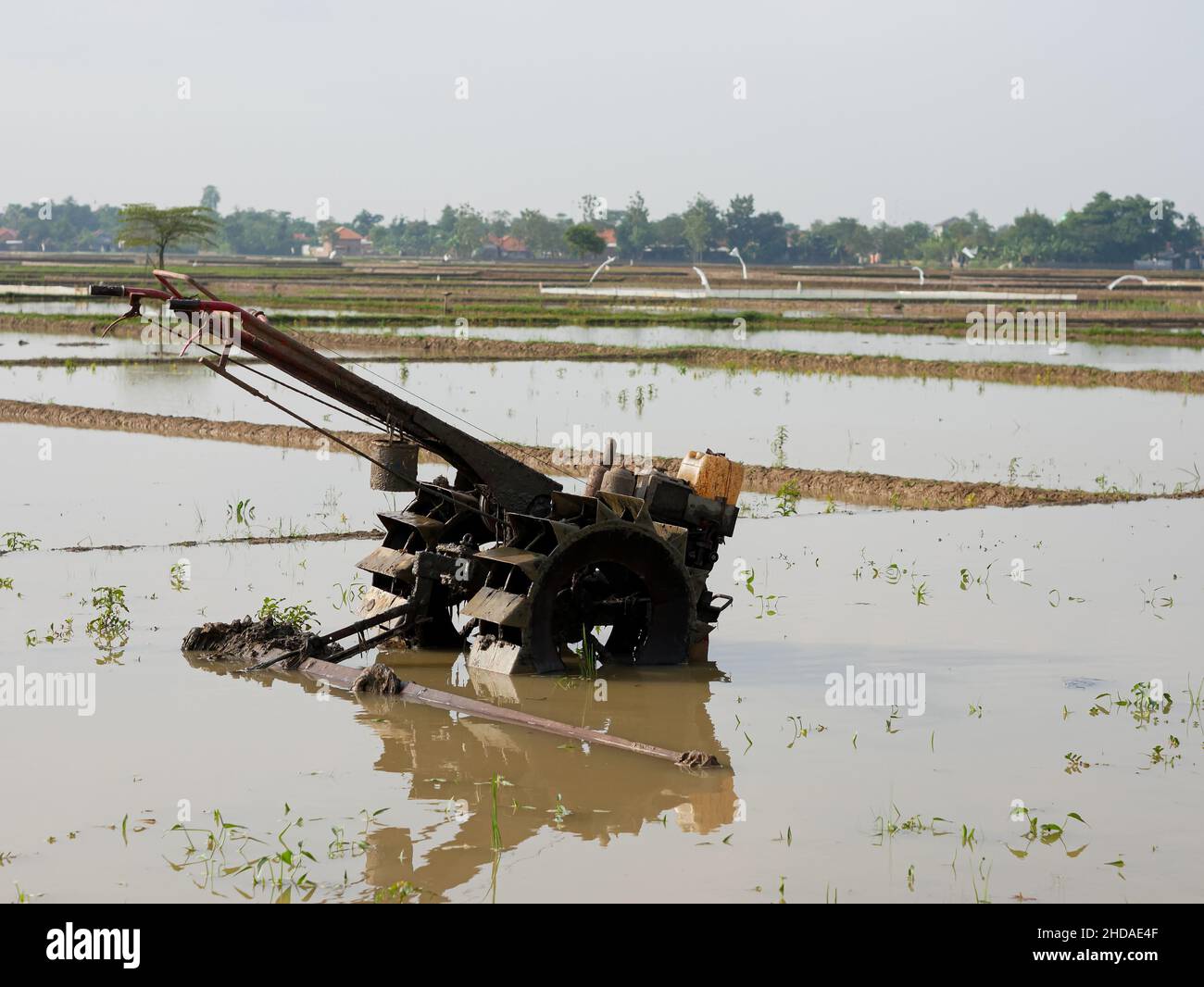 A hand tractor is a popular farm equipment in the Indonesia. used by ...