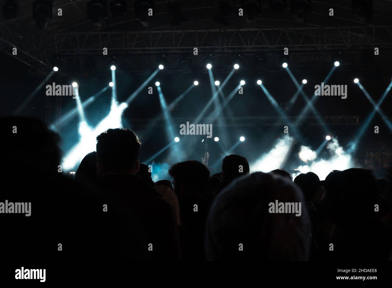 Concert background. Stage with spotlights and silhouette of people ...