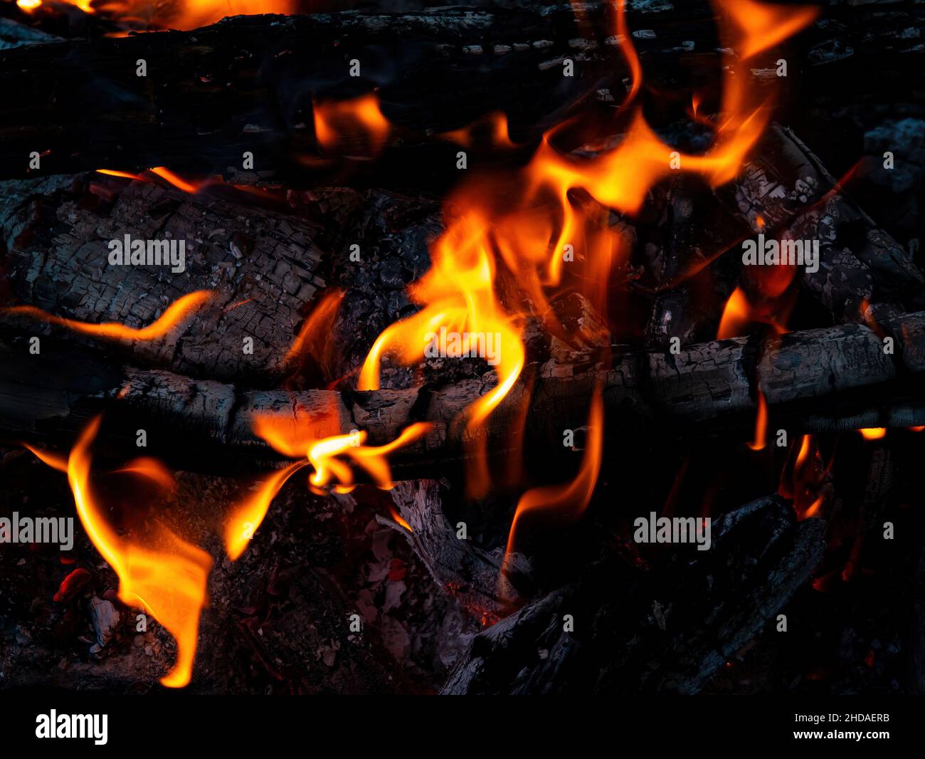 Orange flames of fire of a wood fire Stock Photo - Alamy